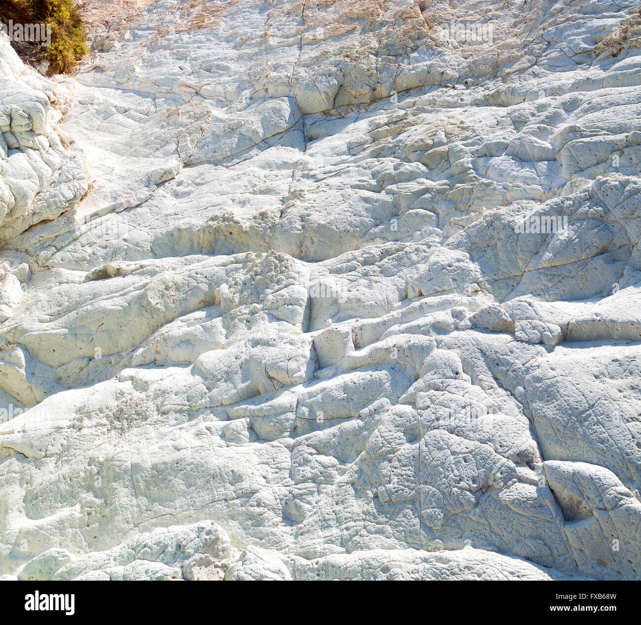santorini europe greece and dry bush rock alone in the sky Stock Photo ...