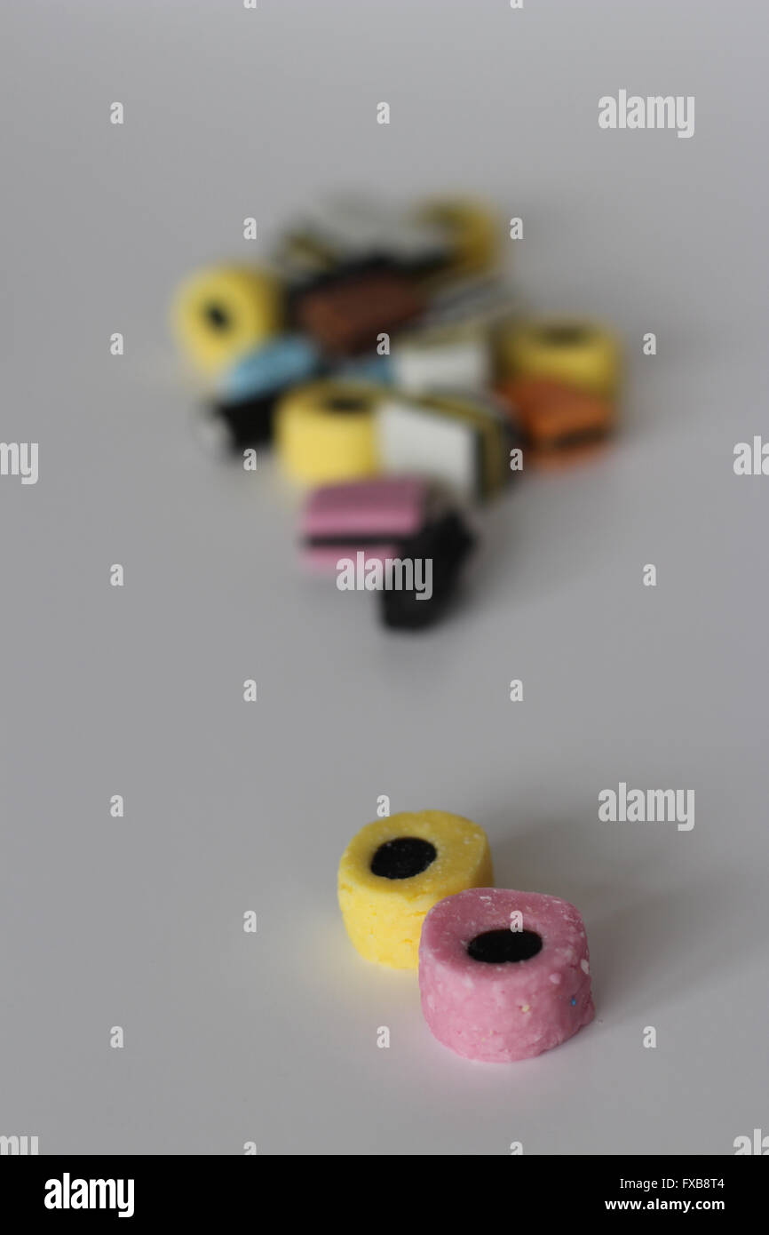 Liquorice Allsorts displayed on a white background Stock Photo - Alamy