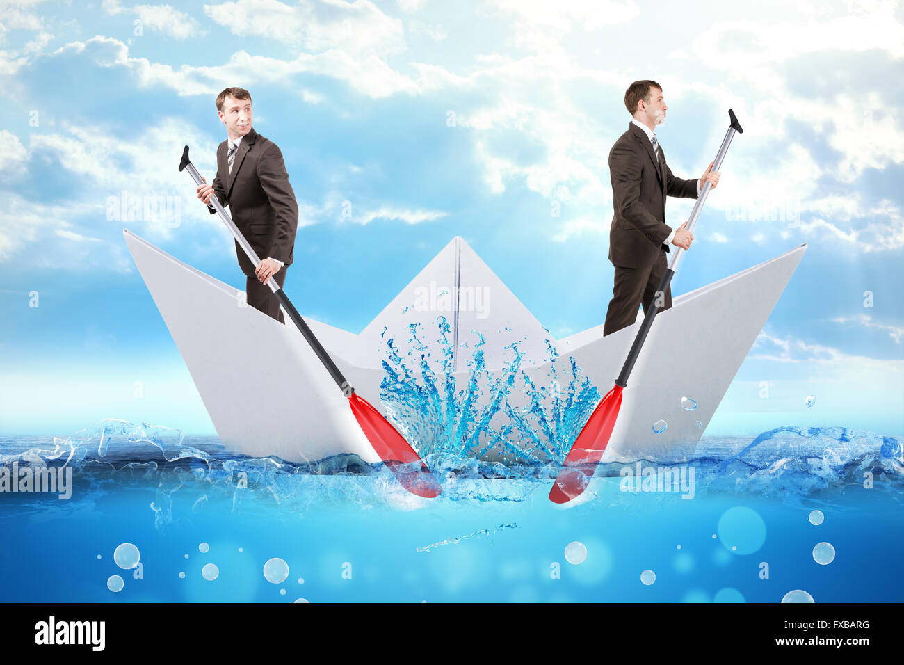 Two businessmen in paper boat Stock Photo - Alamy
