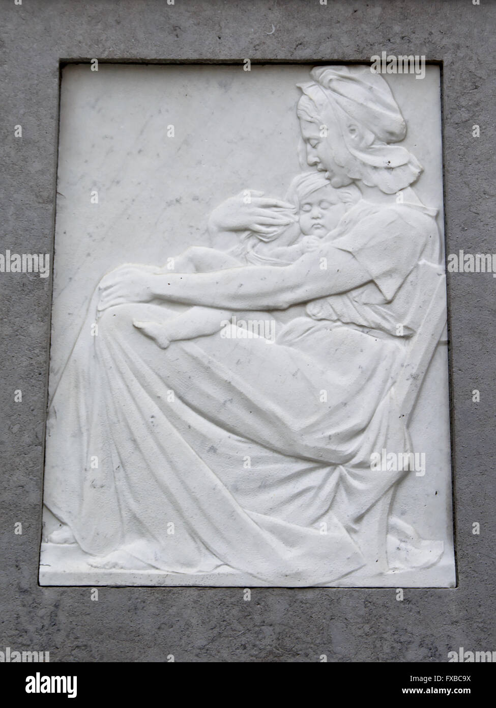 Marble bas-relief of mother with young child Stock Photo - Alamy
