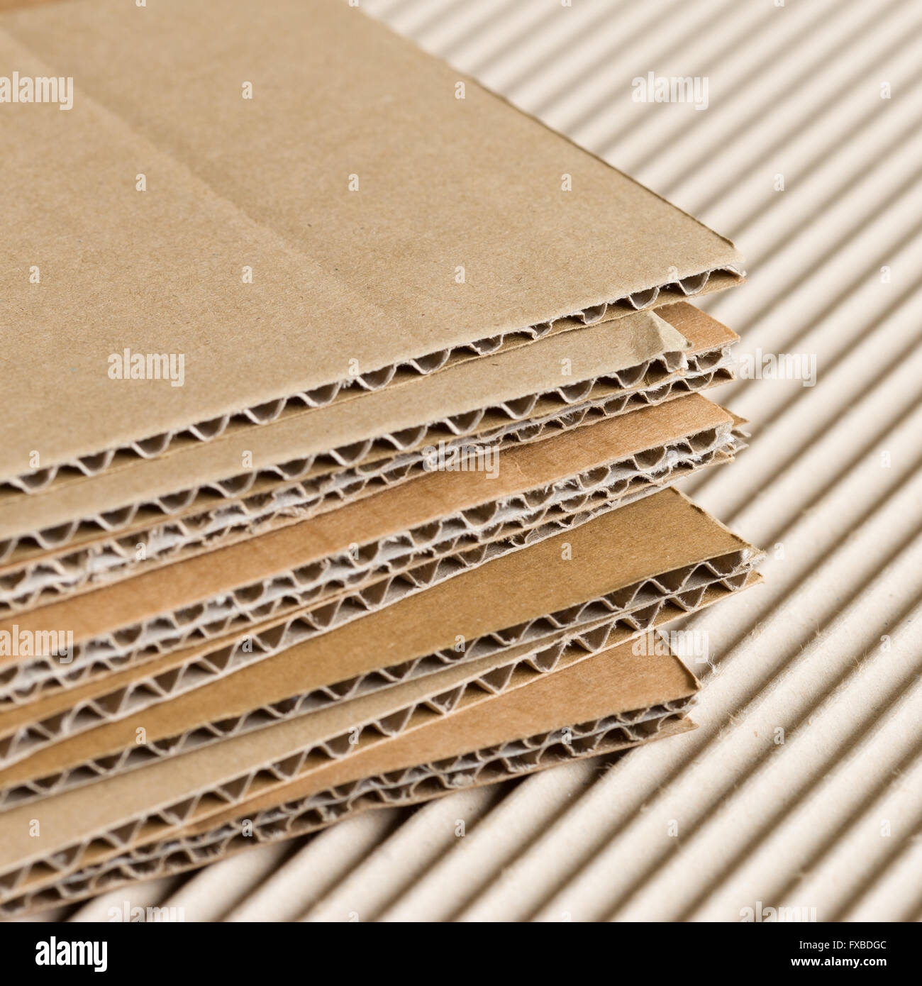 Cardboard pile background Stock Photo - Alamy