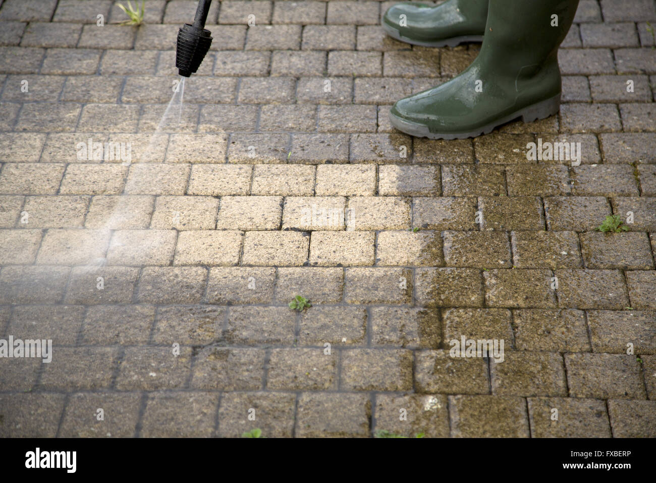 Outdoor floor cleaning with high pressure water jet Stock Photo - Alamy