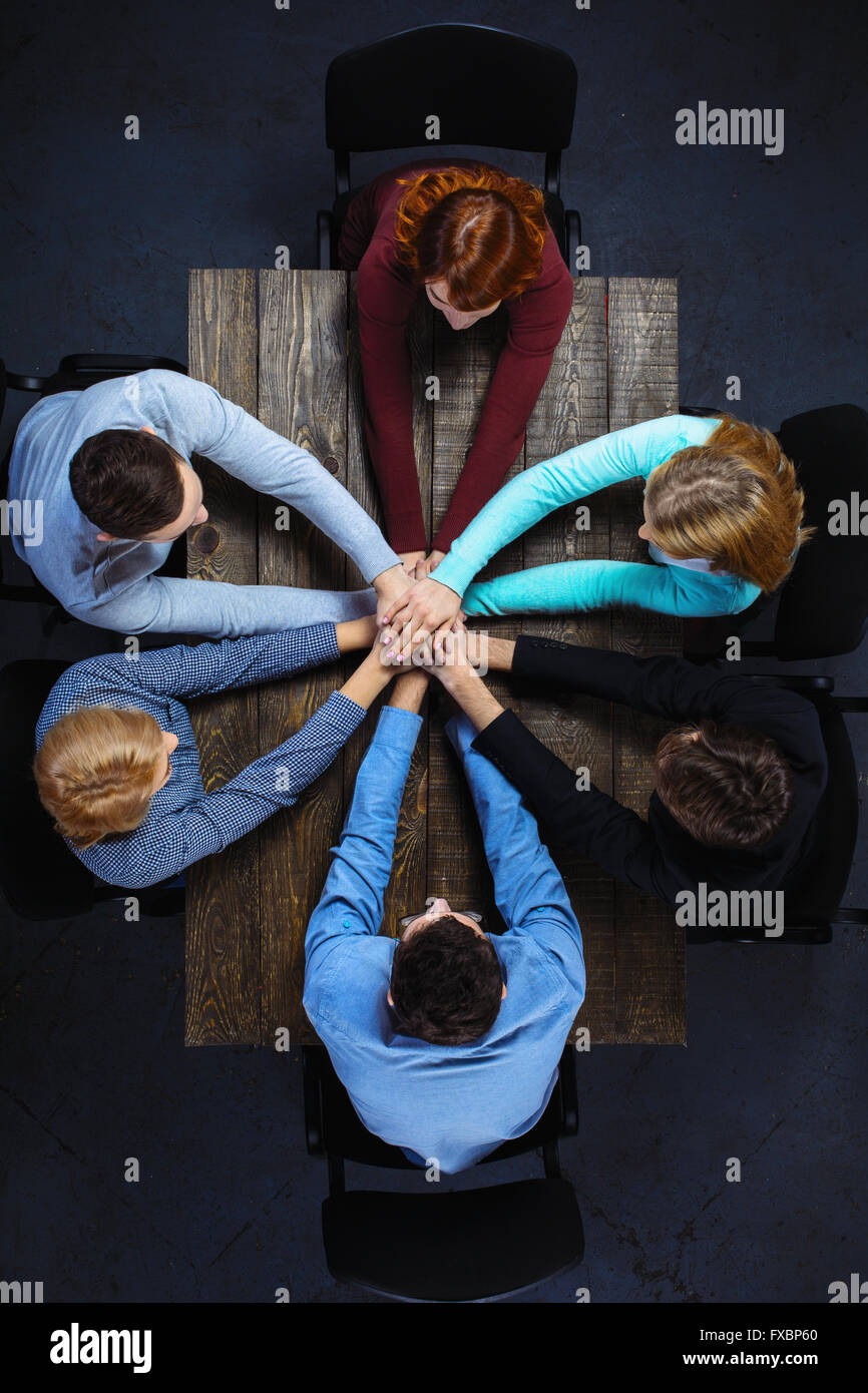 Top view of business people at wooden table Stock Photo - Alamy