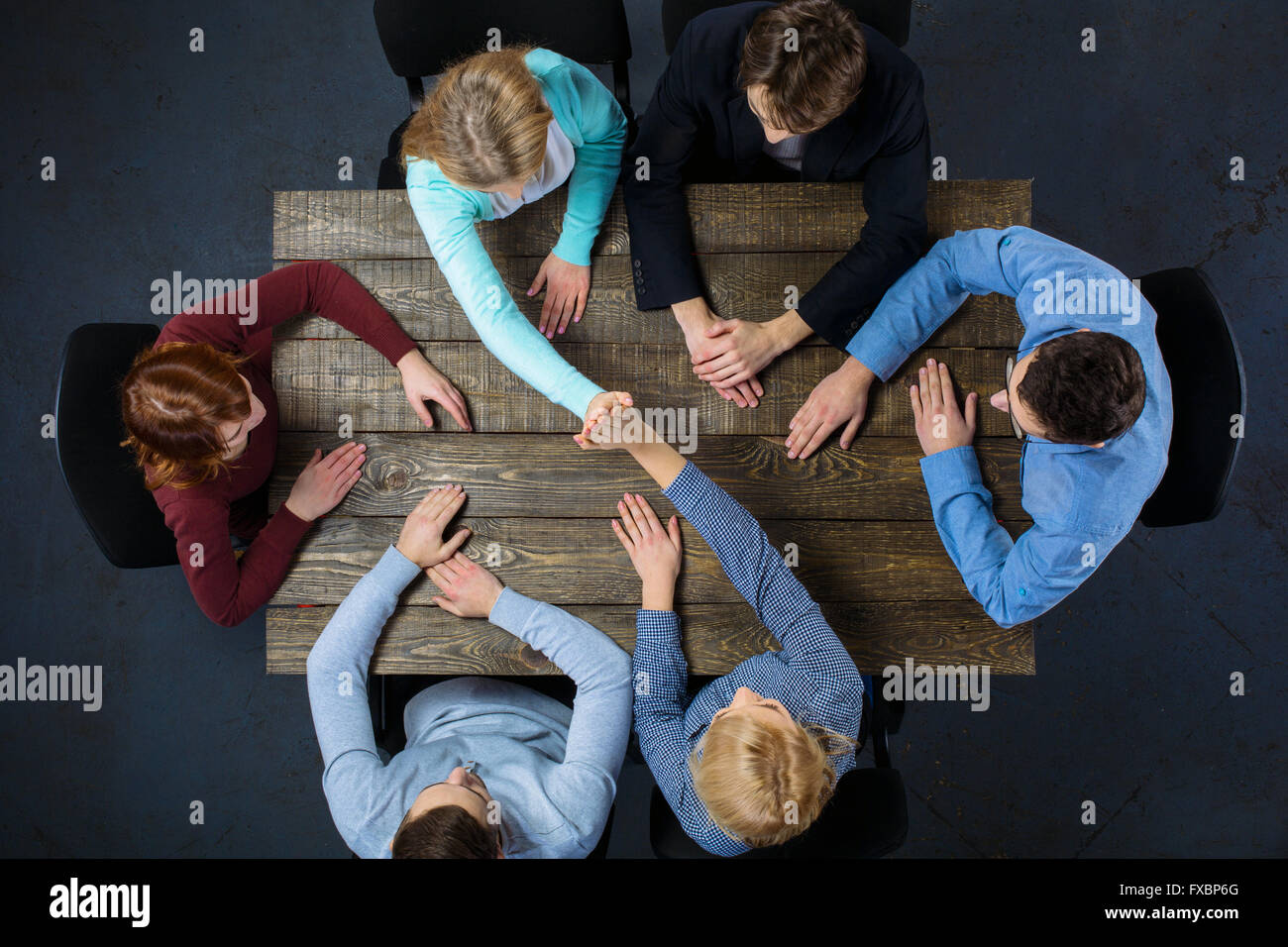 Top view of business people at wooden table Stock Photo - Alamy