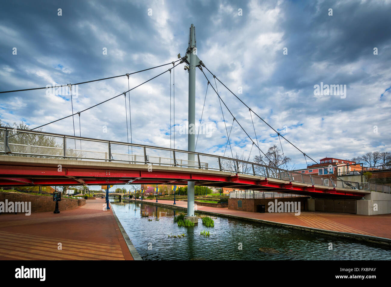 Modern pedestrian bridge over Carroll Creek, in Frederick, Maryland ...