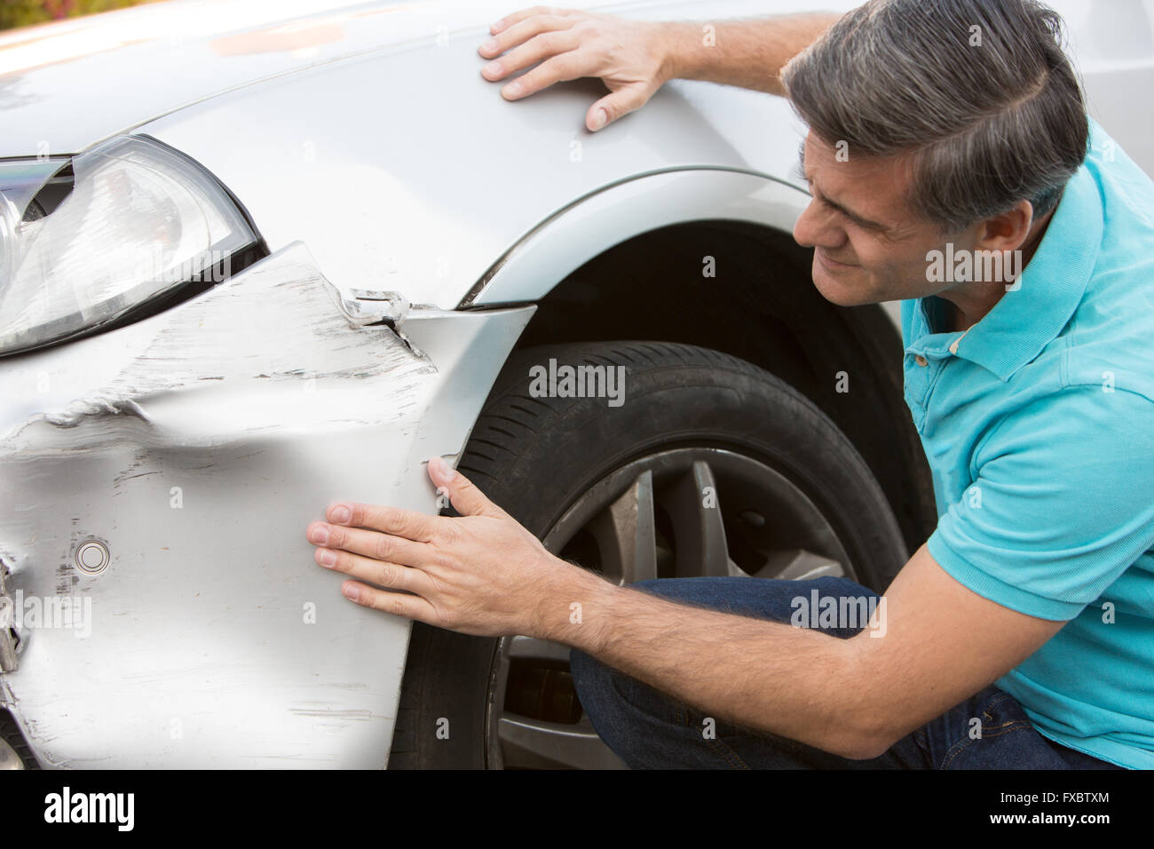 Unhappy Driver Inspecting Damage After Car Accident Stock Photo - Alamy