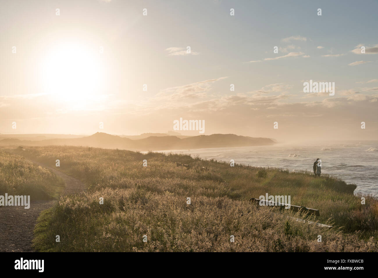 Walking along the cliffs at Seahouses, Northumberland Stock Photo - Alamy
