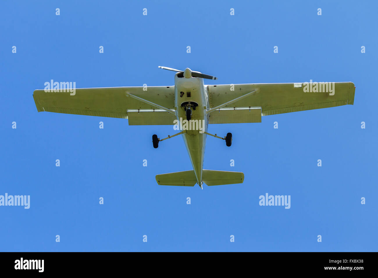 Plane flying light propellor aircraft two seater closeup upward sky ...