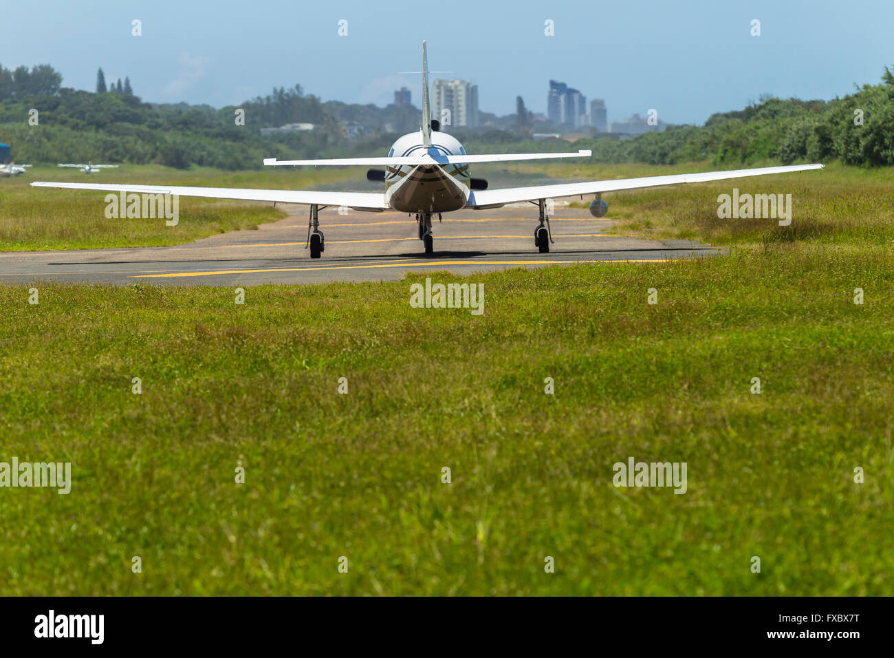 Aircraft propeller plane flight ready to take off down runway rear ...