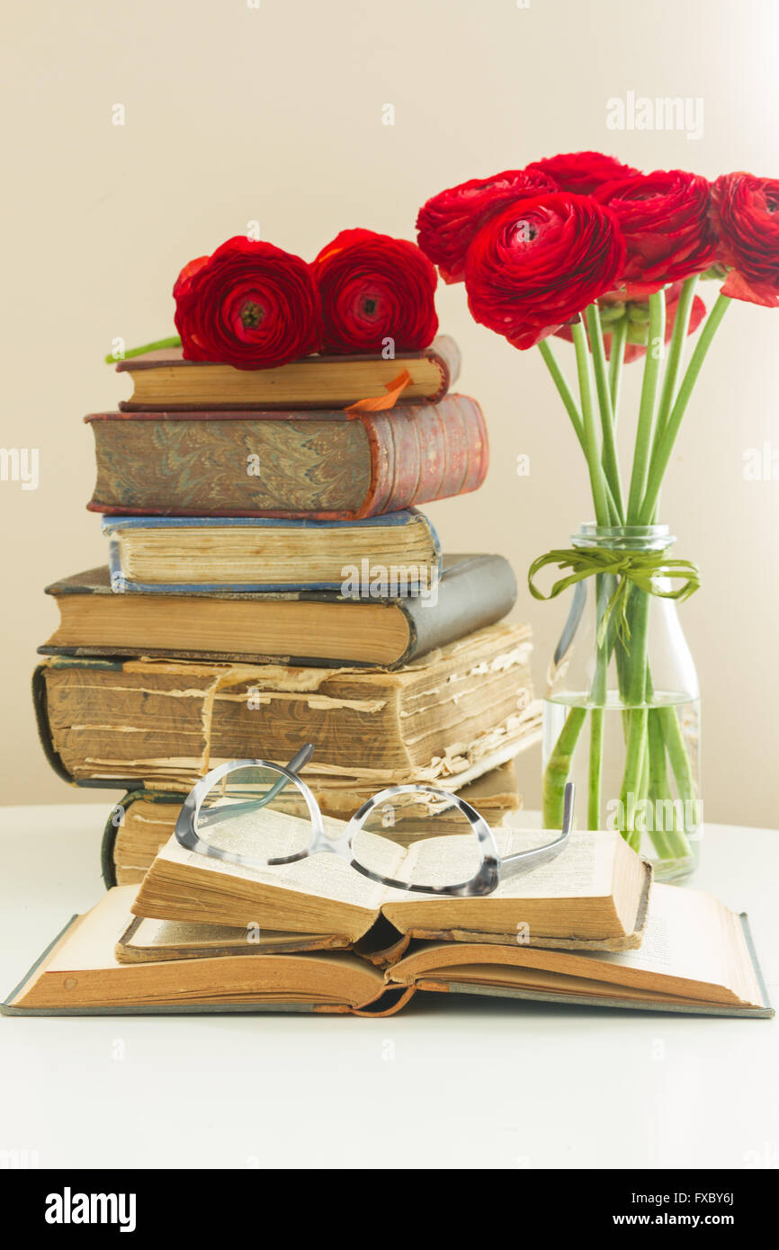 Old books with rose flower Stock Photo - Alamy