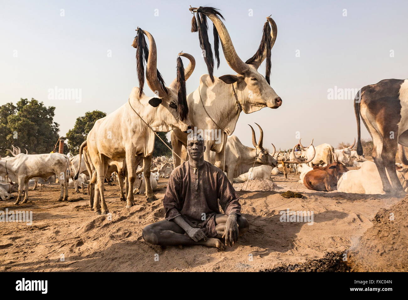 South Sudan. 21st Feb, 2016. A Mundari man sits between his two ...