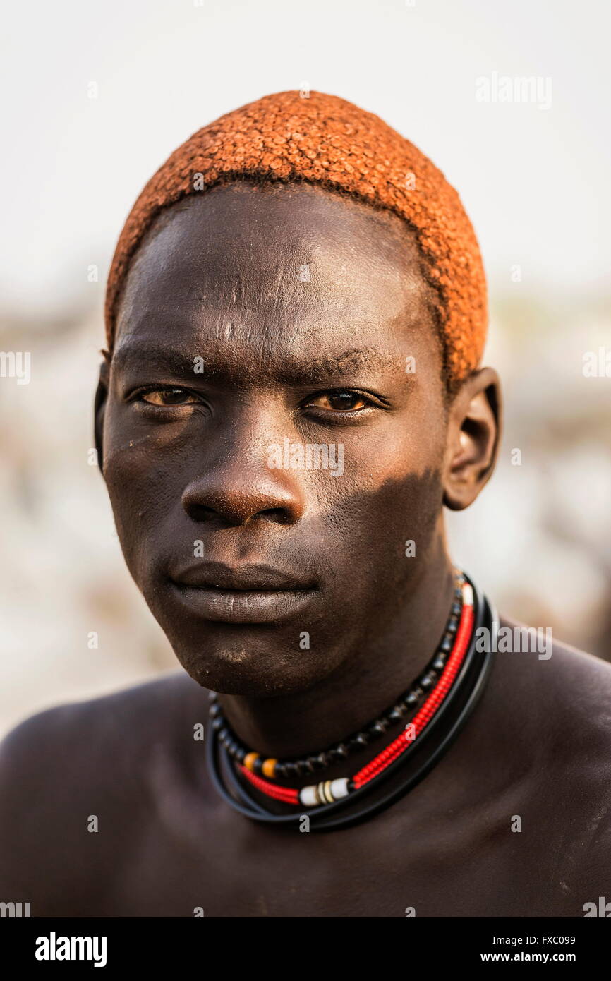 South Sudan. 22nd Feb, 2016. A Mundari man shows off a popular hair style. Showering in the cows ...