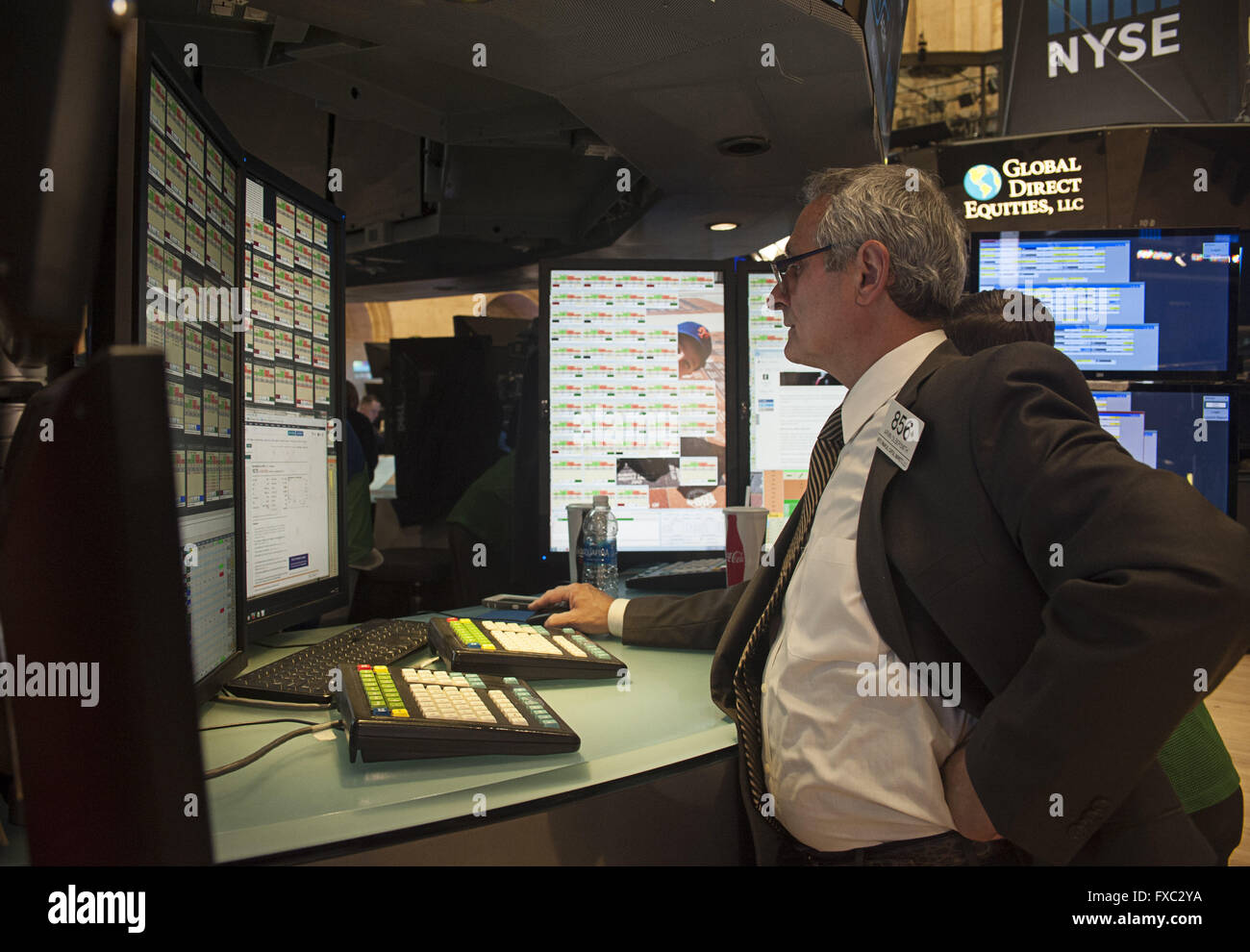 New York, USA. 13th Apr, 2016. Trader works on the floor of the New ...