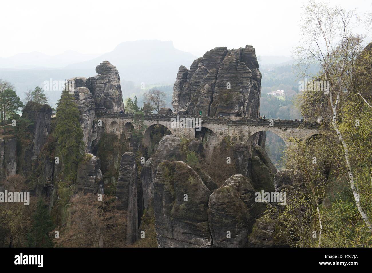 Rathen, Germany. 14th Apr, 2016. Tourists walk over the Bastei bridge ...