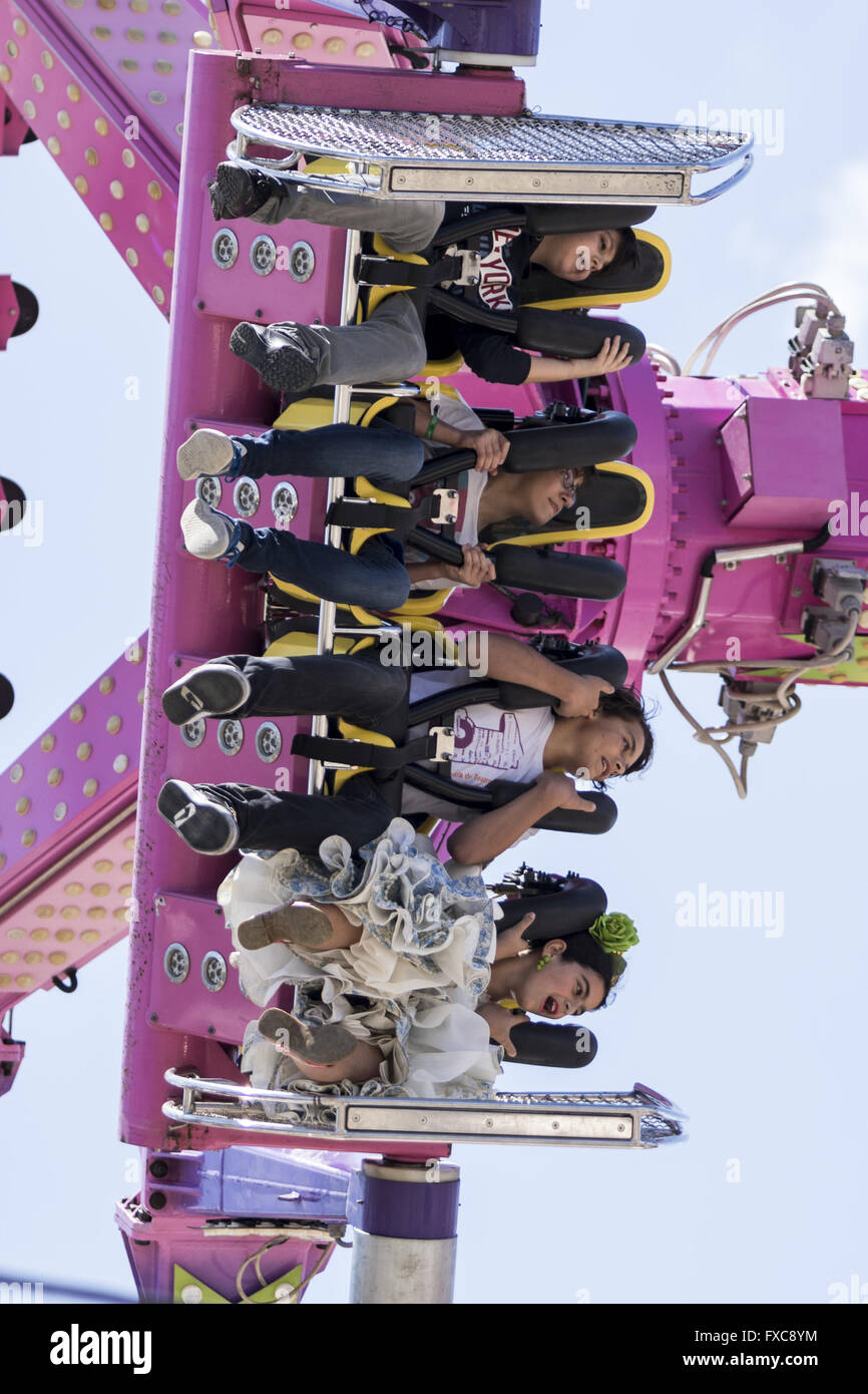 Seville, Spain. 14th Apr, 2016. A young dressed in traditional flamenco ...