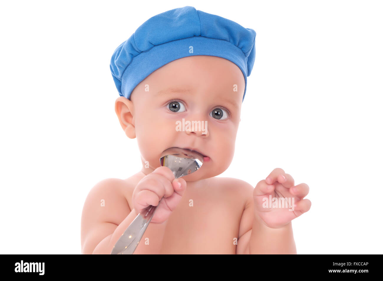 Baby. Portrait of a young child with a spoon on a white background ...