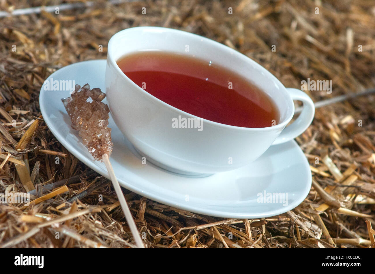 delicious cup of tea on straw background Stock Photo - Alamy