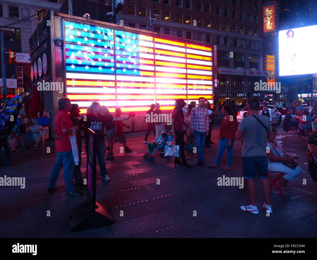 Us flag in times square hi-res stock photography and images - Alamy