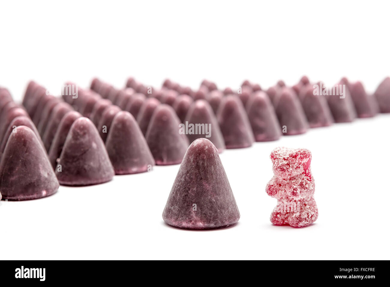 This pyramidal cuberdons with an acid in bear close up Stock Photo - Alamy