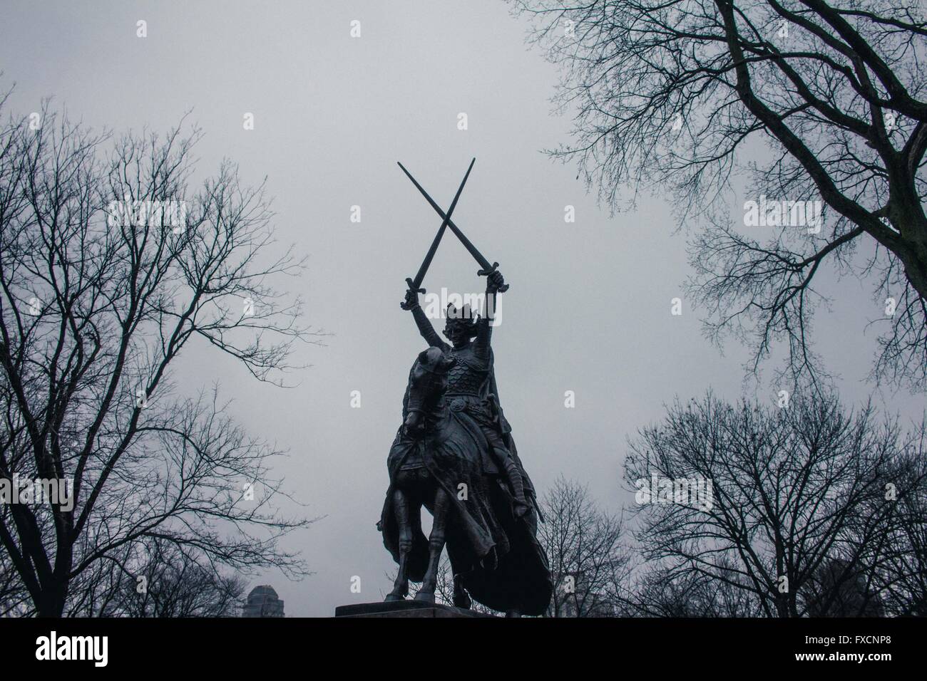 A statue of a man on horseback holding two swords, in Central Park, New ...