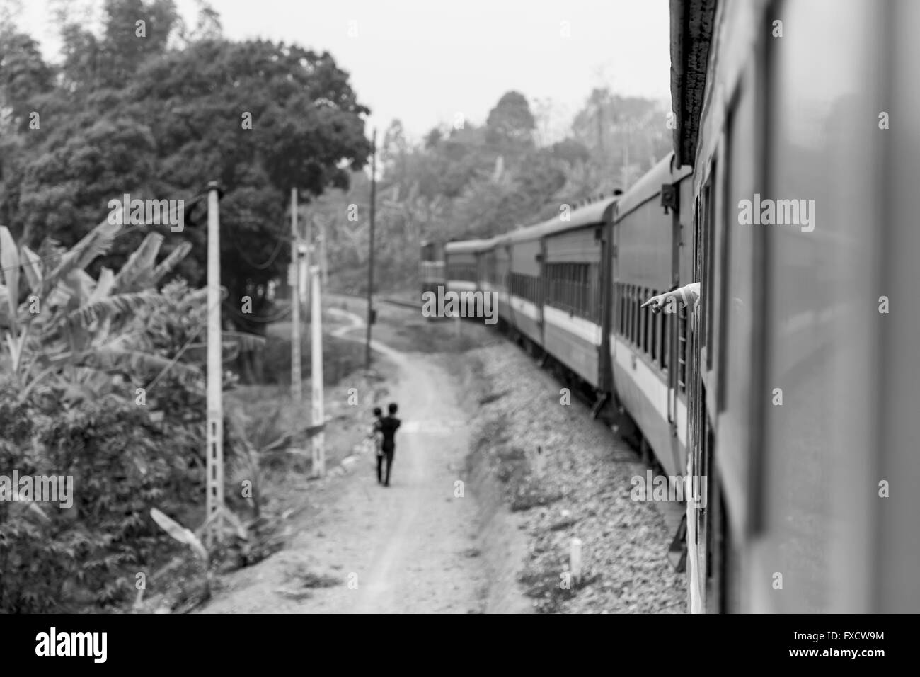 A kid pointing out the window of a train in Vietnam Stock Photo - Alamy