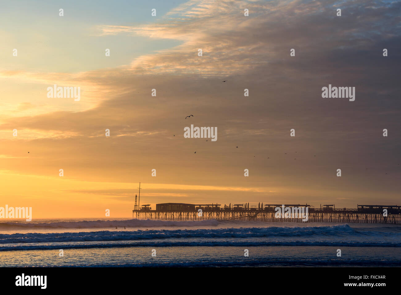 Sunset on the Pacific Ocean, the sun breaks through the mist and famous ...