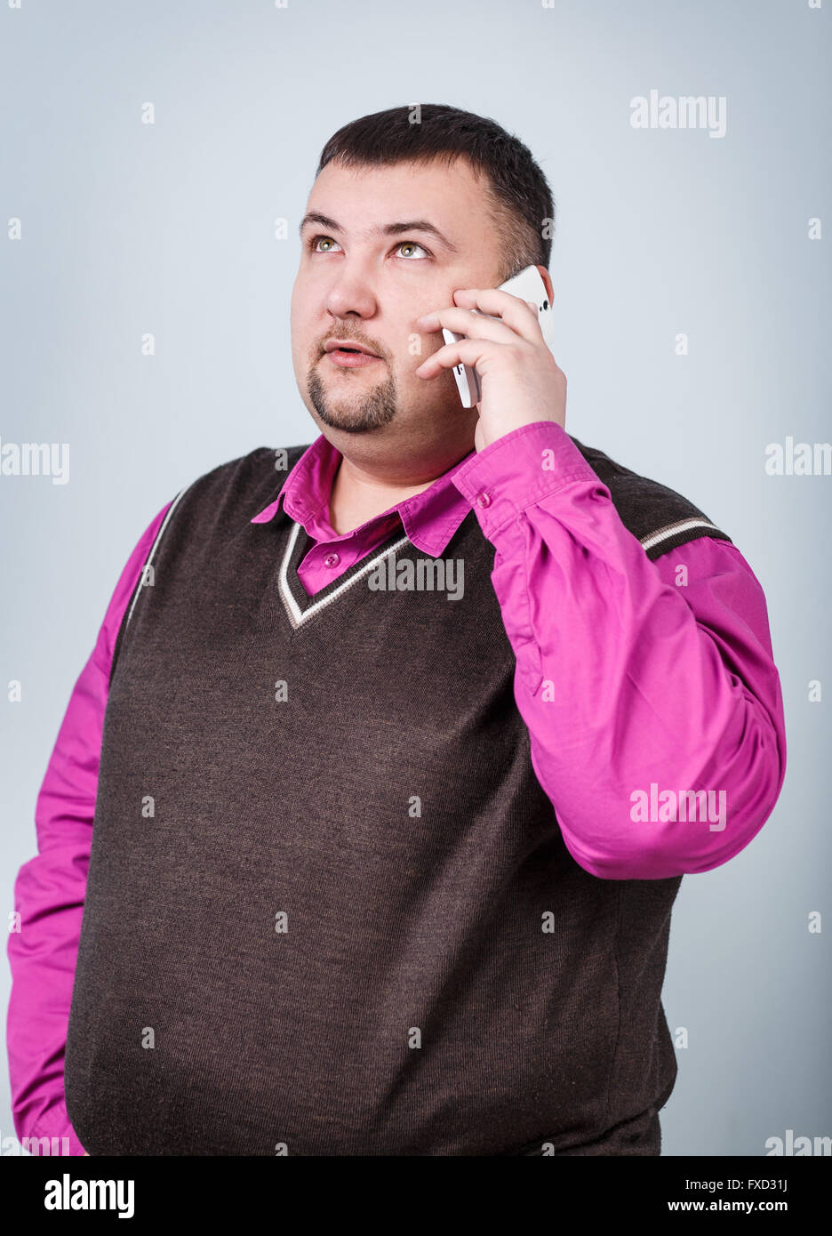 Man with overweight speaks on the phone Stock Photo - Alamy