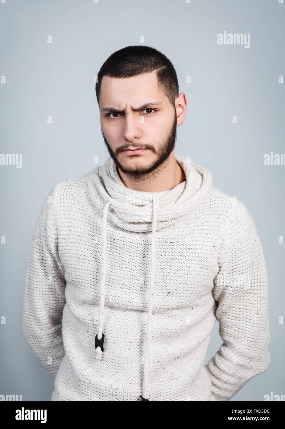 Young handsome man with serious face Stock Photo - Alamy