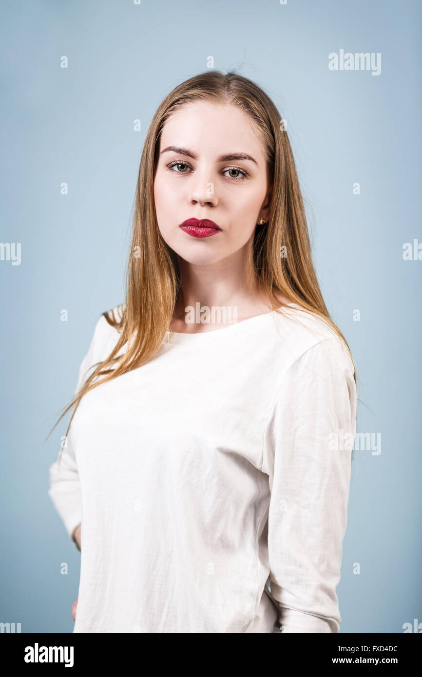 Young beautiful woman with serious face Stock Photo - Alamy