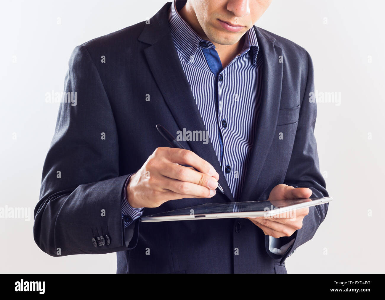 business young man searching in the web with his tablet Stock Photo - Alamy
