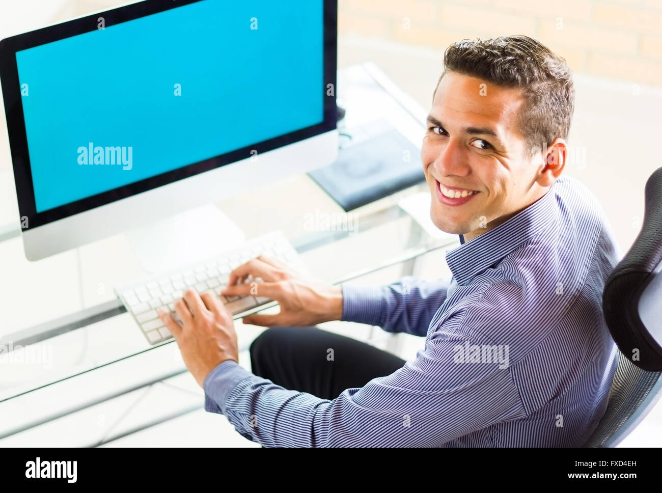 Young business man working on his computer Stock Photo - Alamy