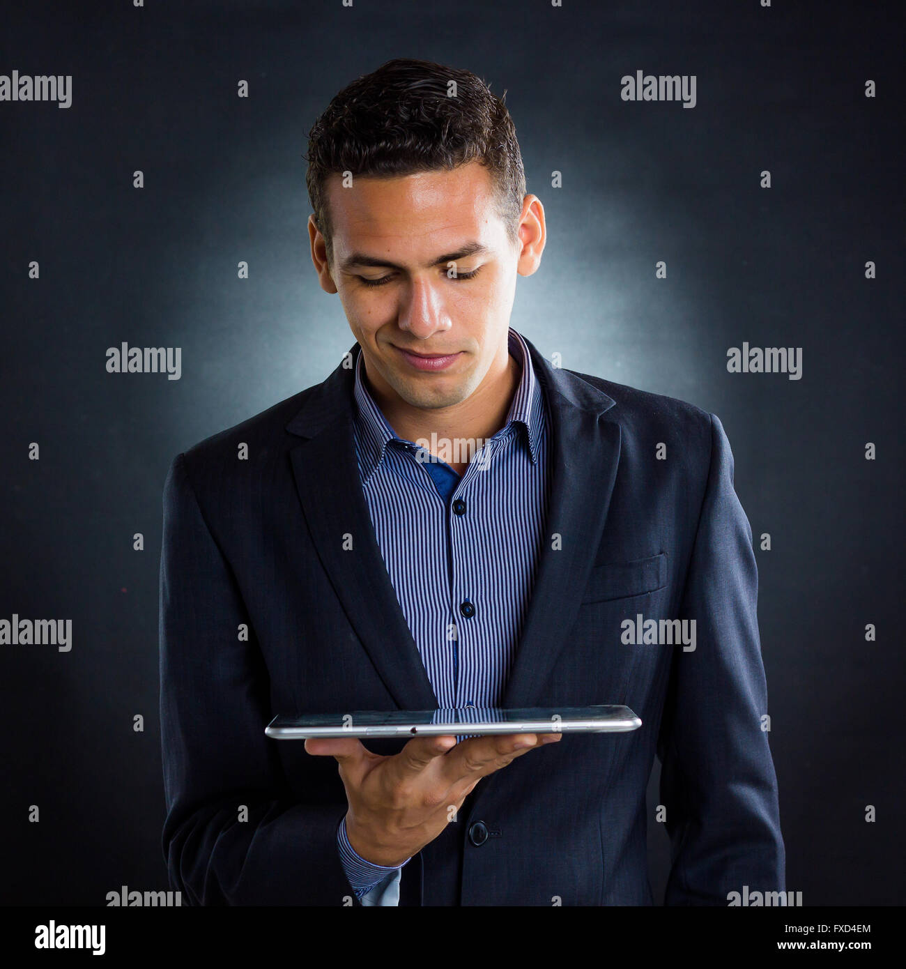 man holding a tablet checking his finance Stock Photo - Alamy