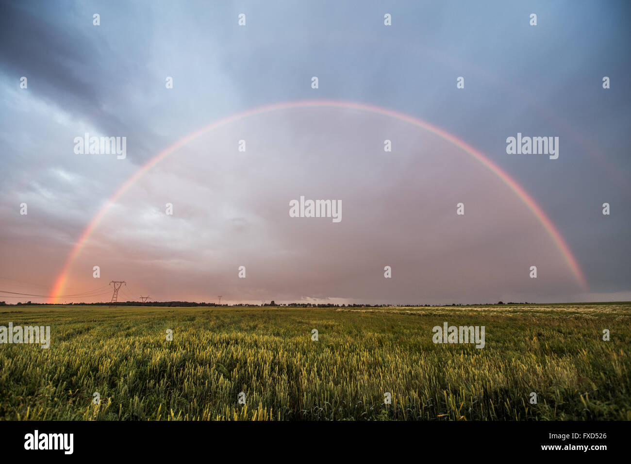 Rainbow over rural landscape Stock Photo - Alamy