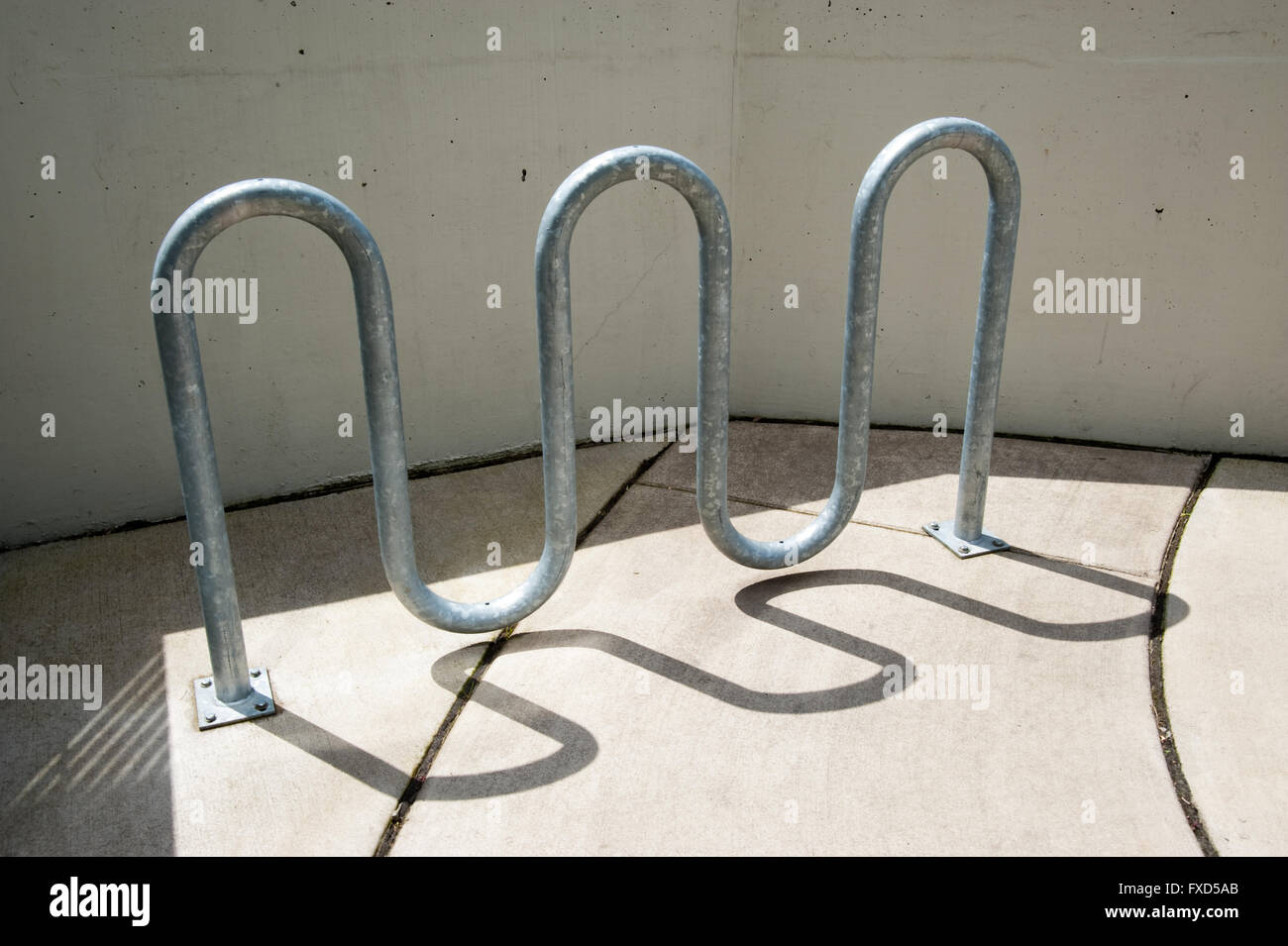 Bike rack and shadow Stock Photo - Alamy