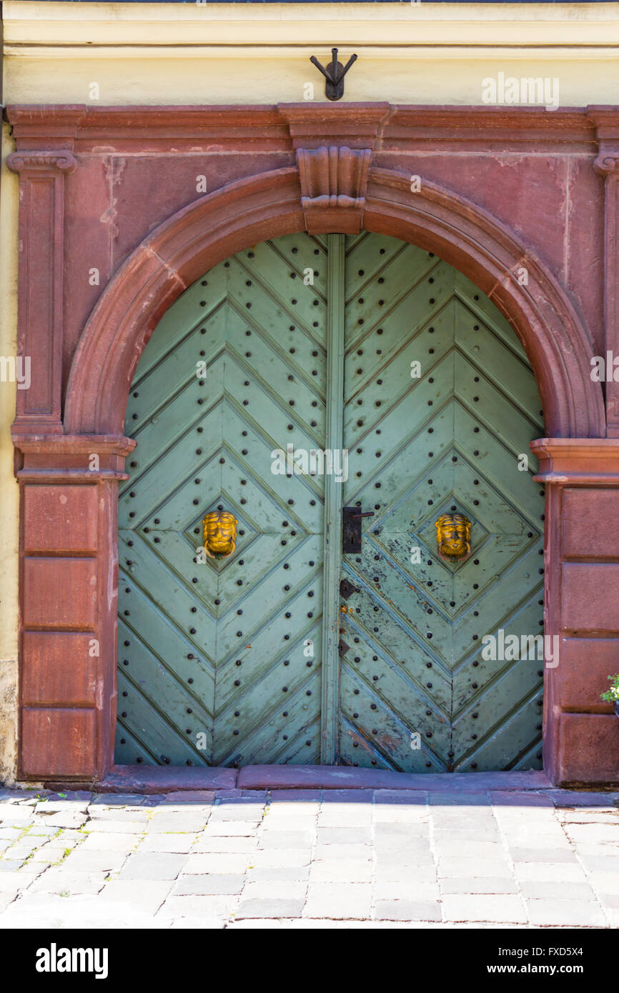 Very old gate in the historical building in the streets of Old Town in ...