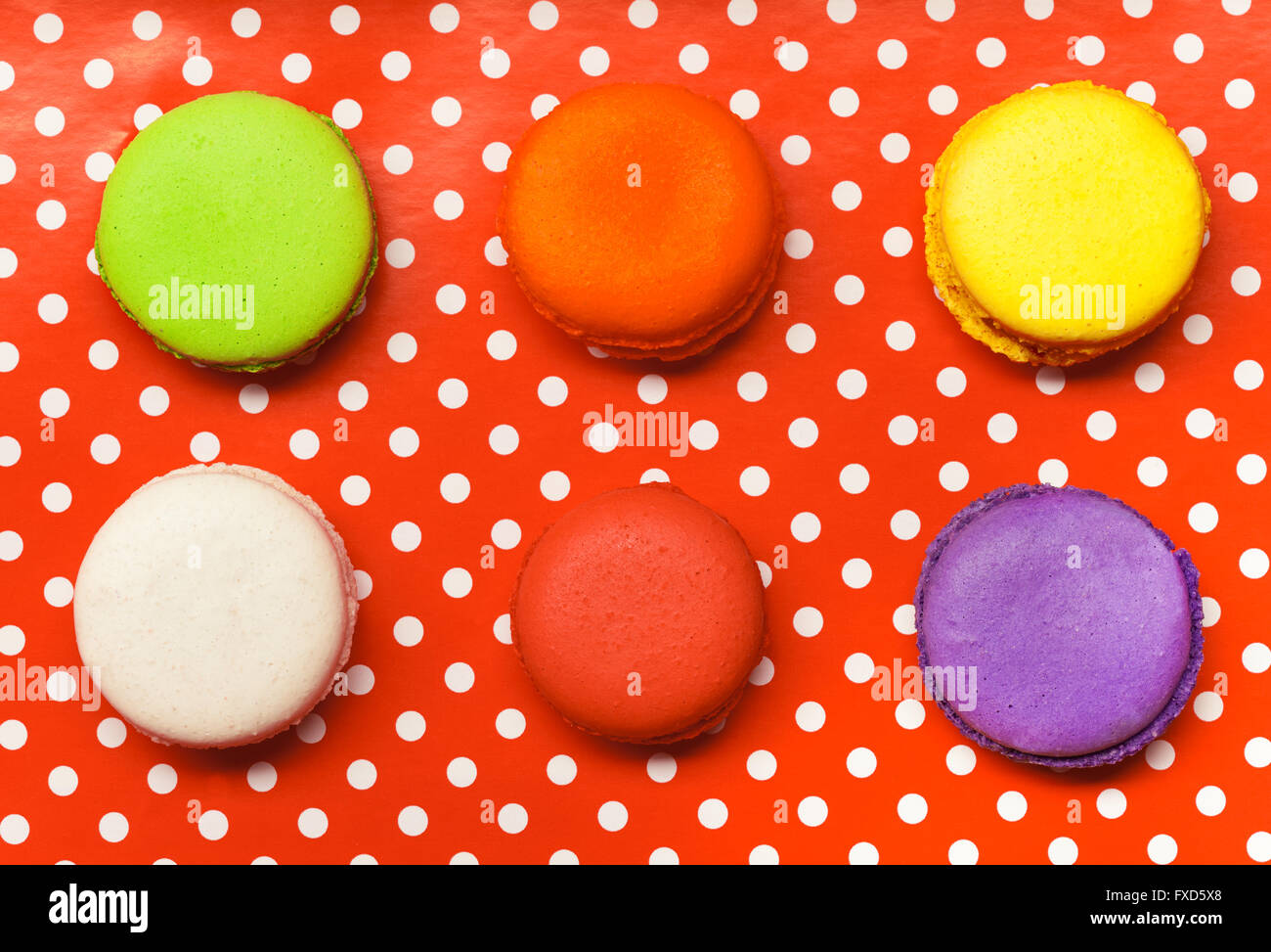 Six macarons laying on red polka-dot tray Stock Photo - Alamy
