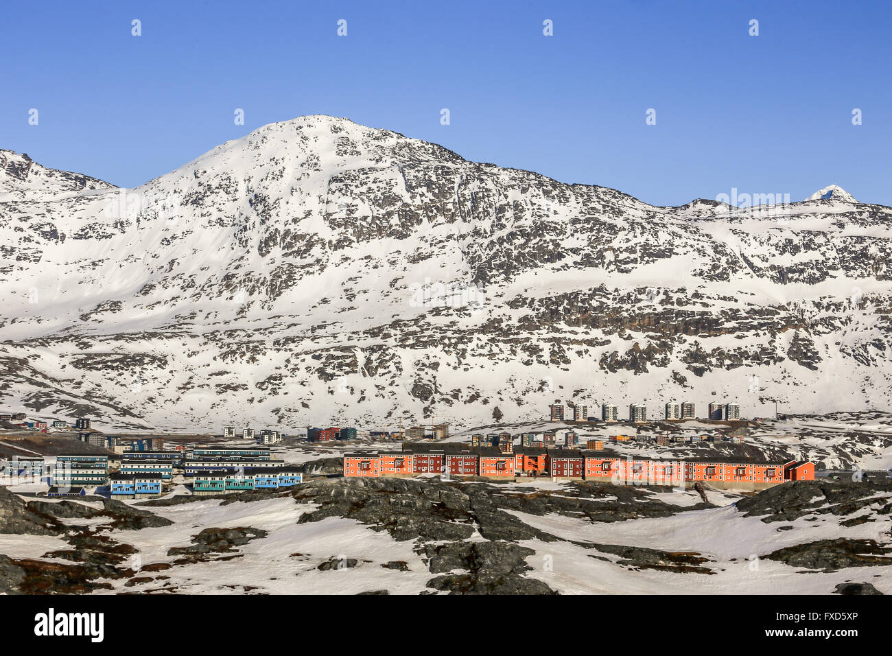 Modern Inuit houses and Ukkusissat (Store Malene) mountain in the ...
