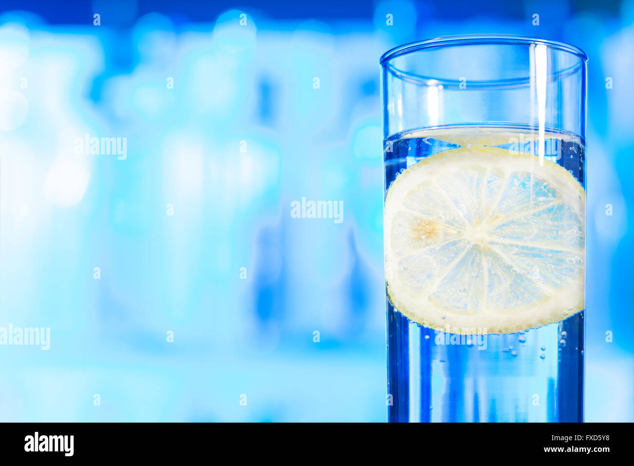 Close-up picture of glossy water glass with lemon Stock Photo - Alamy
