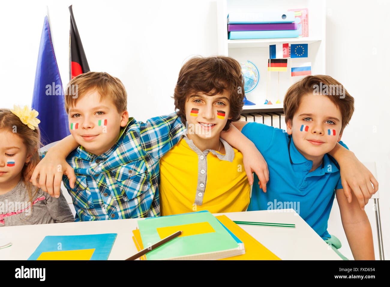 Pupils with flags on cheeks learning languages Stock Photo - Alamy