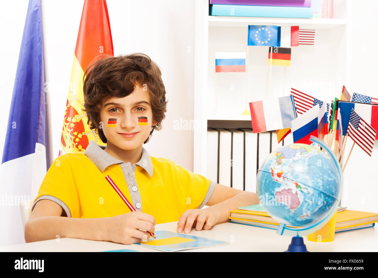 German schoolboy writing at copybook in classroom Stock Photo - Alamy