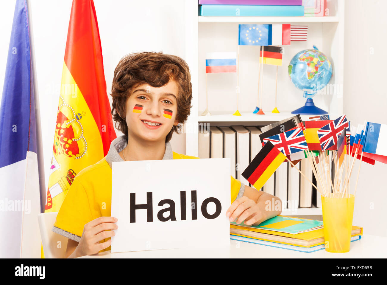 Schoolboy learning German at the light classroom Stock Photo - Alamy