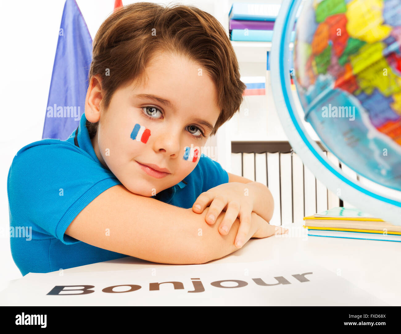 French schoolboy learning geography with the globe Stock Photo - Alamy