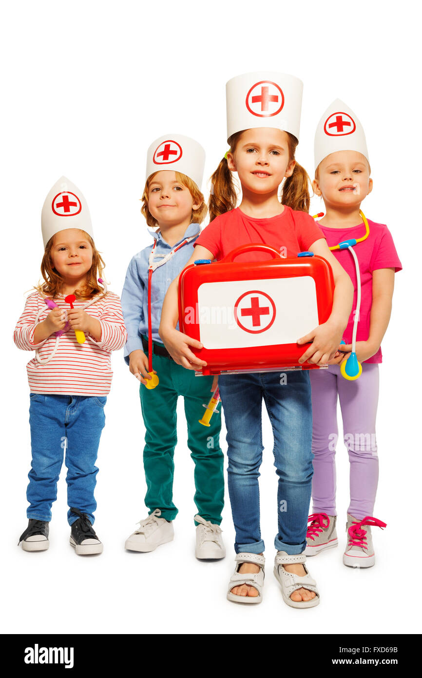 Little doctors with medical box giving first aid Stock Photo - Alamy