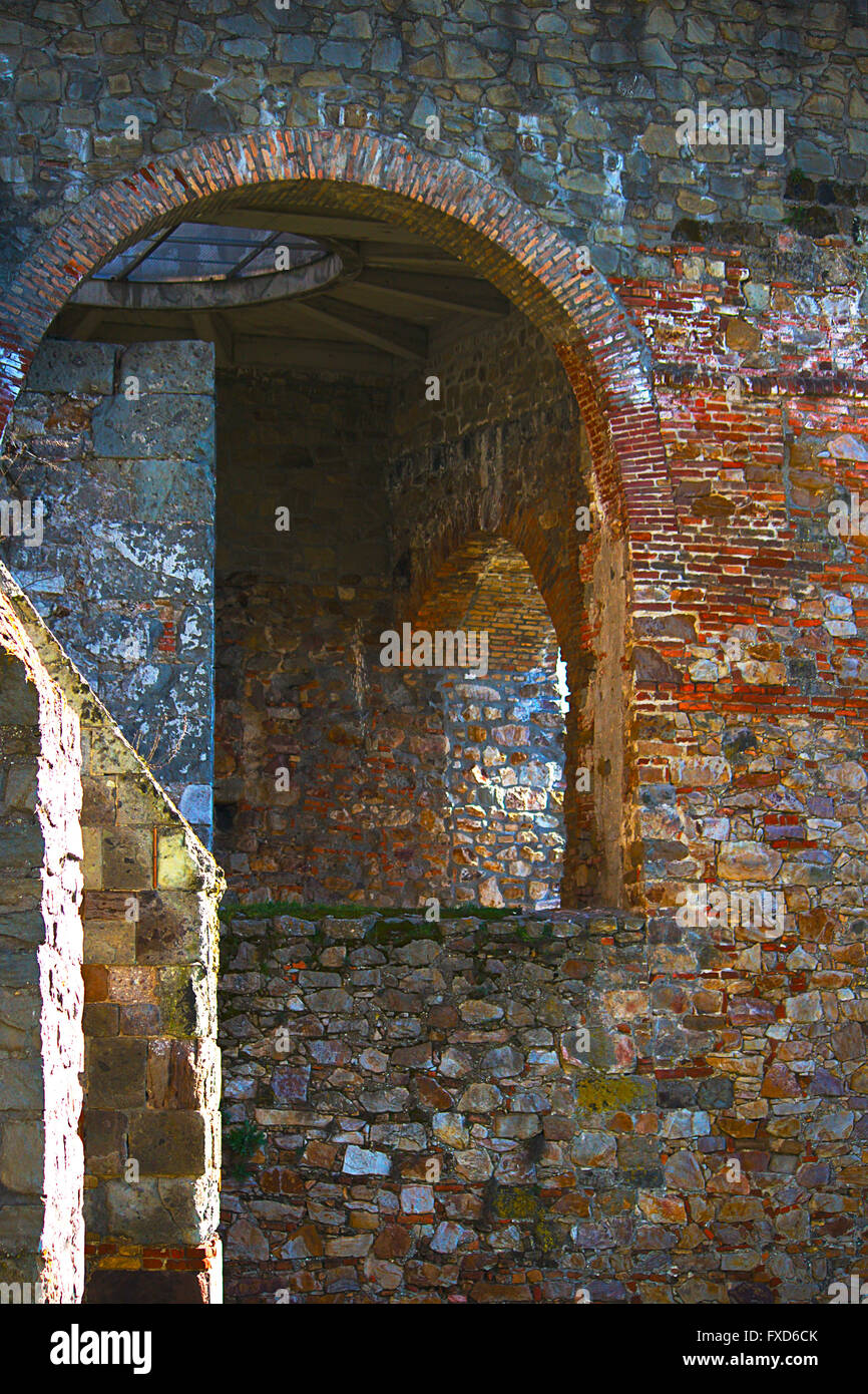 Fragment of old stone bastion with doorway and passages. Hungary ...