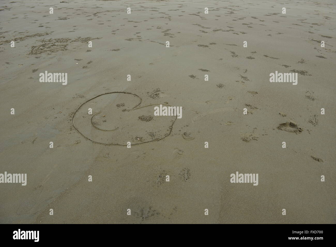 Sandy beach of Graffiti Stock Photo - Alamy