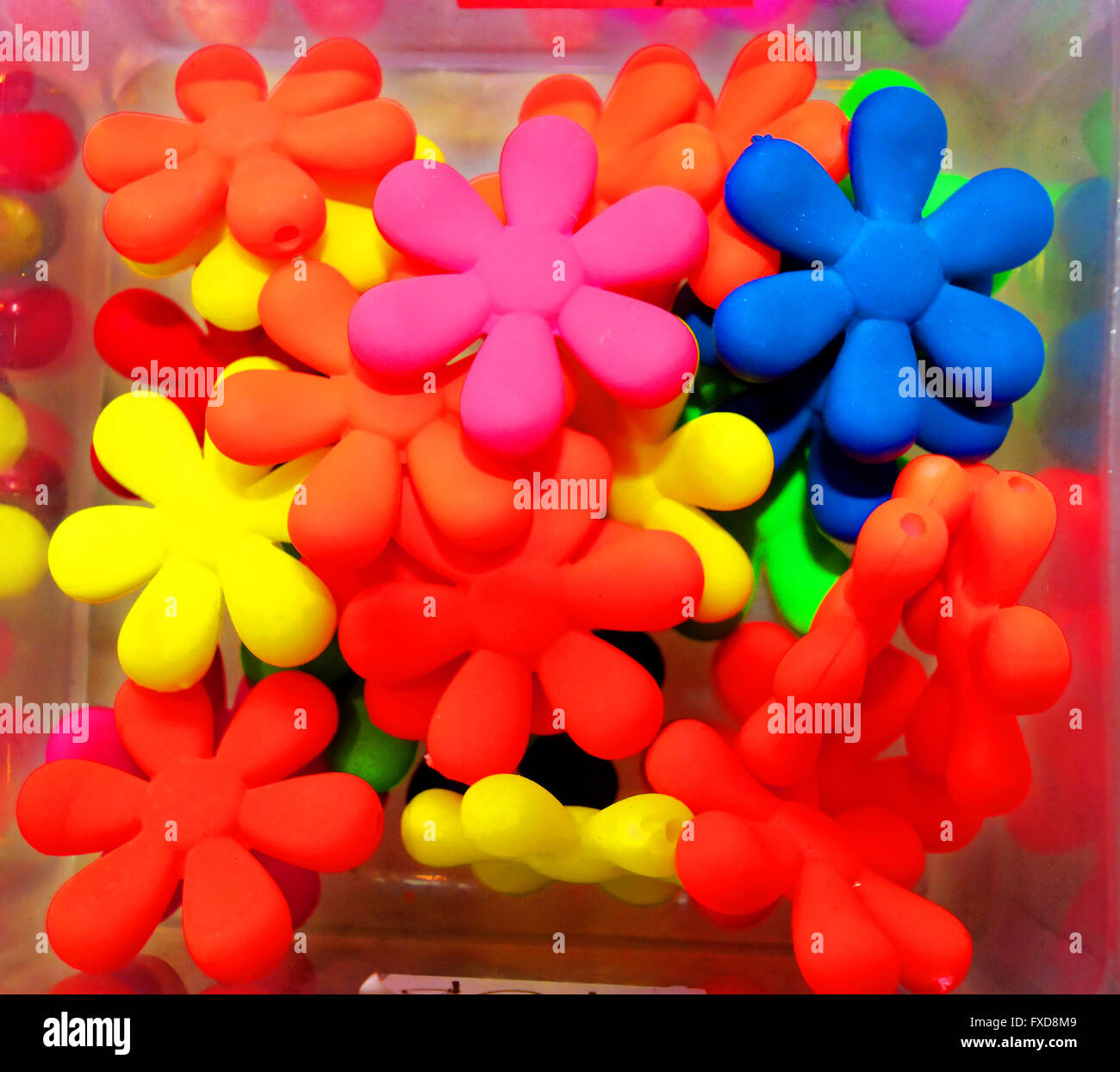 Red blue green yellow spiky star button jewelry Stock Photo - Alamy