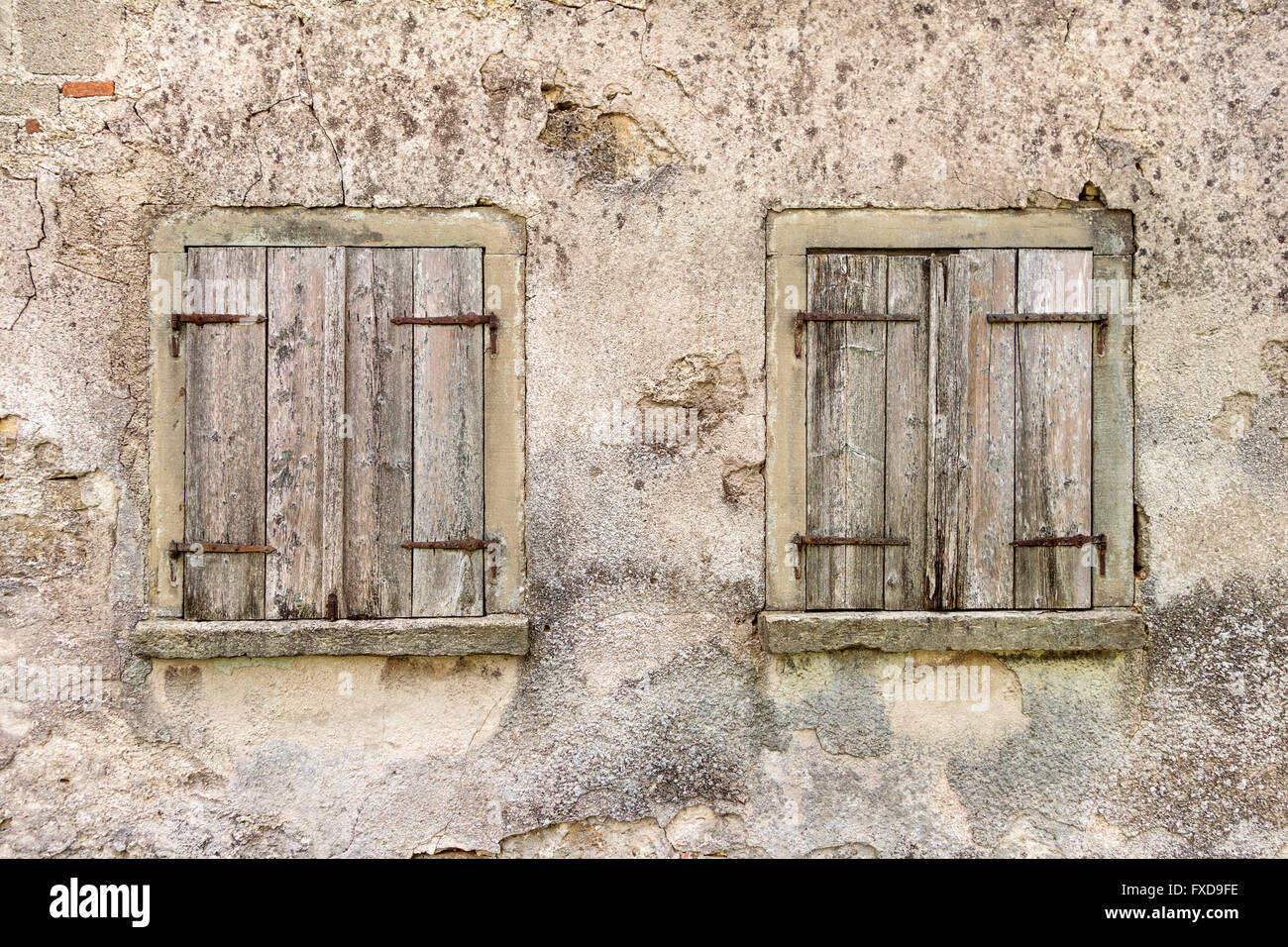 Two old windows with closed shutters Stock Photo - Alamy