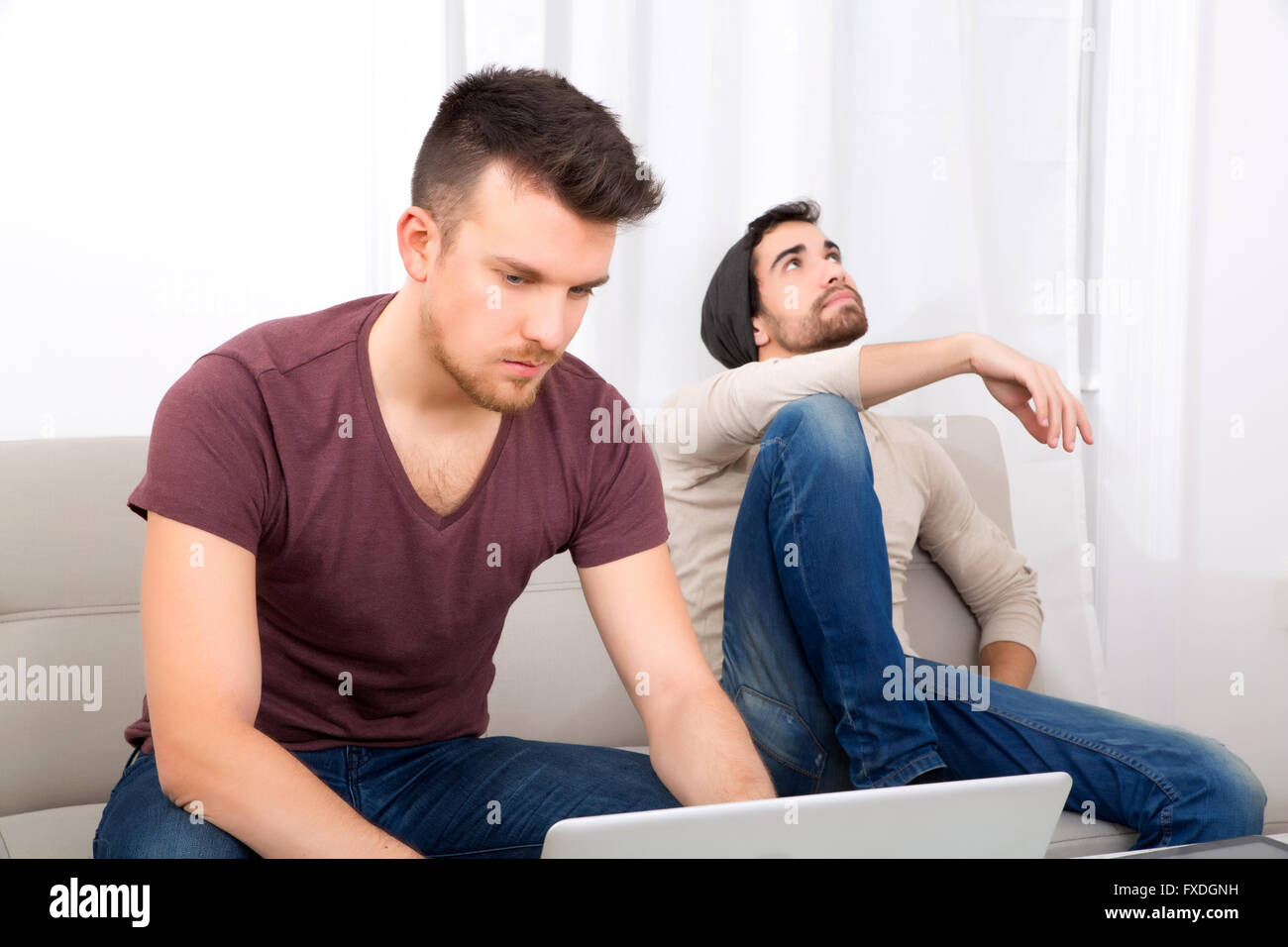 Two young men studying at home Stock Photo - Alamy