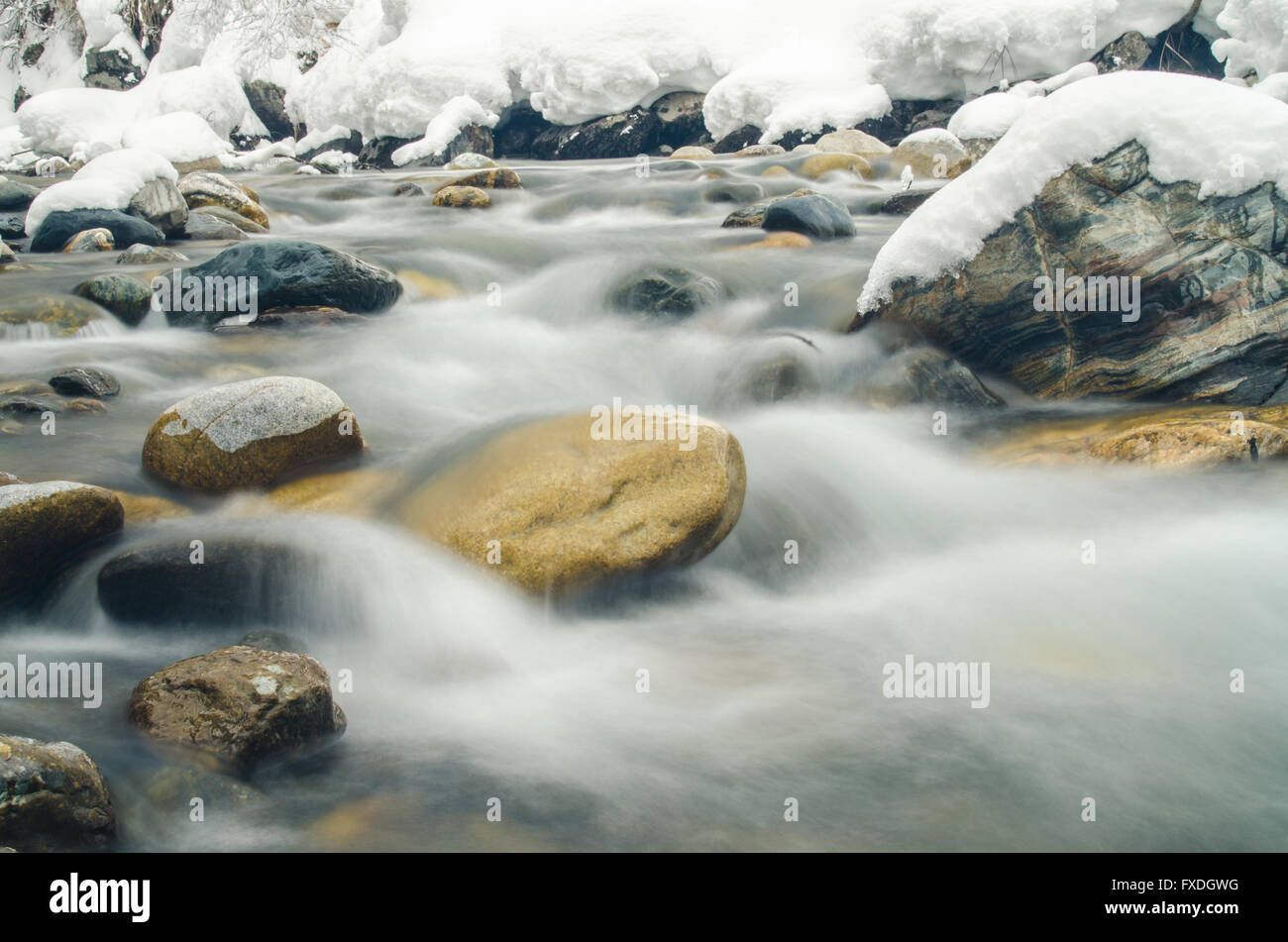 Rapidly flowing mountain river, blurred by a slow shutter speed Stock ...
