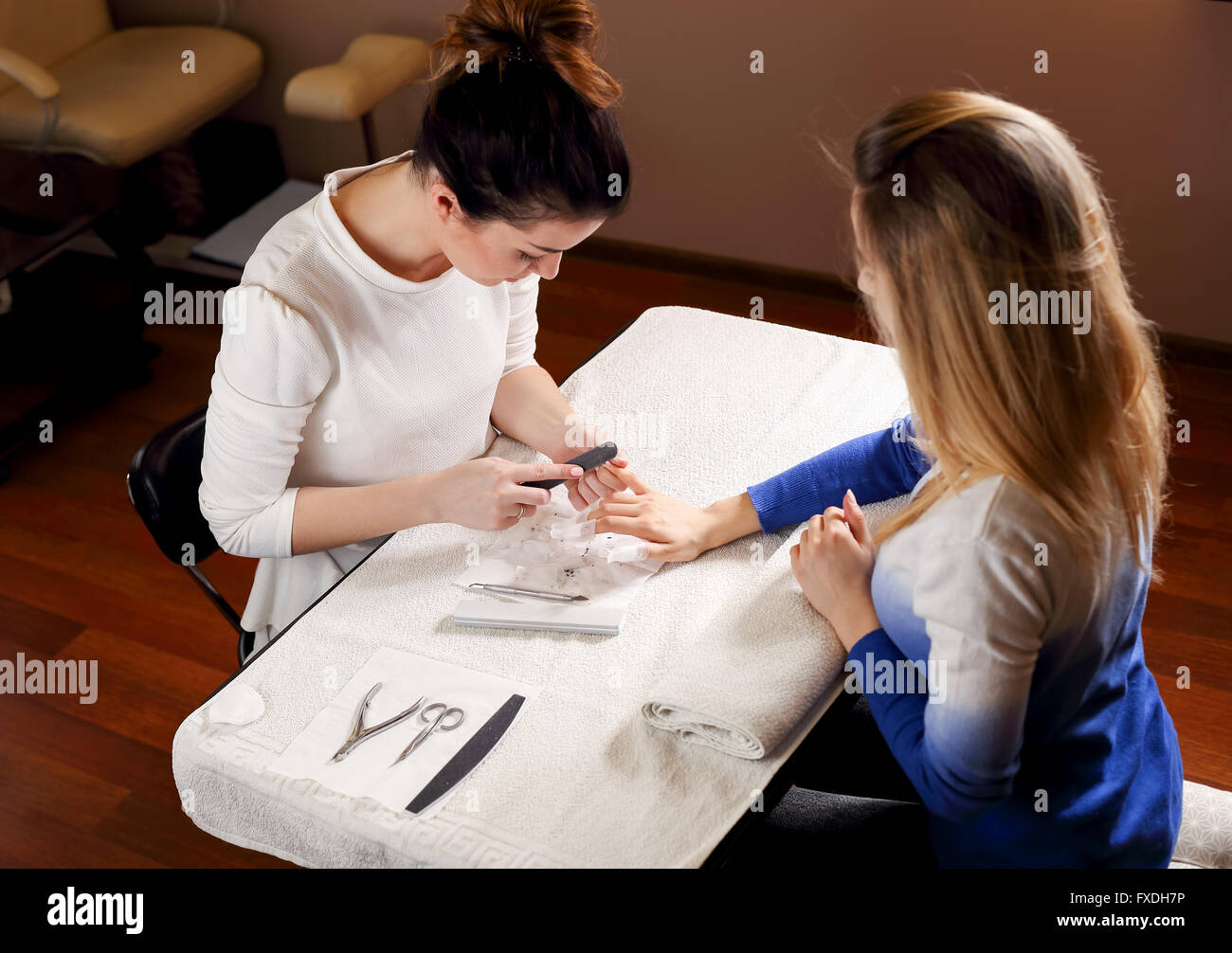 Woman manicurist in beauty salon hi-res stock photography and images ...